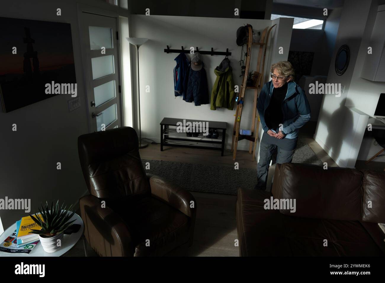 Two-time Olympian Joan Wilder puts on her coat before leaving to ski on ...