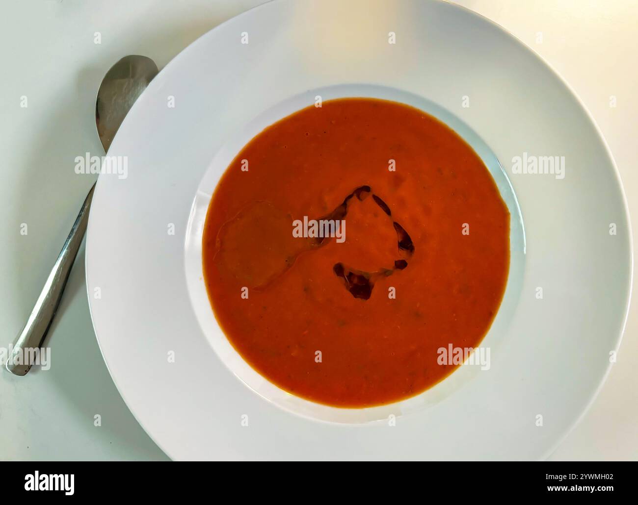 Italian tomato and basil soup with a swirl of olive oil Stock Photo - Alamy