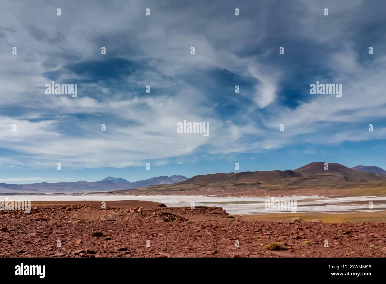 Salt flats and volcano mountains on altiplano high altitude plains in ...