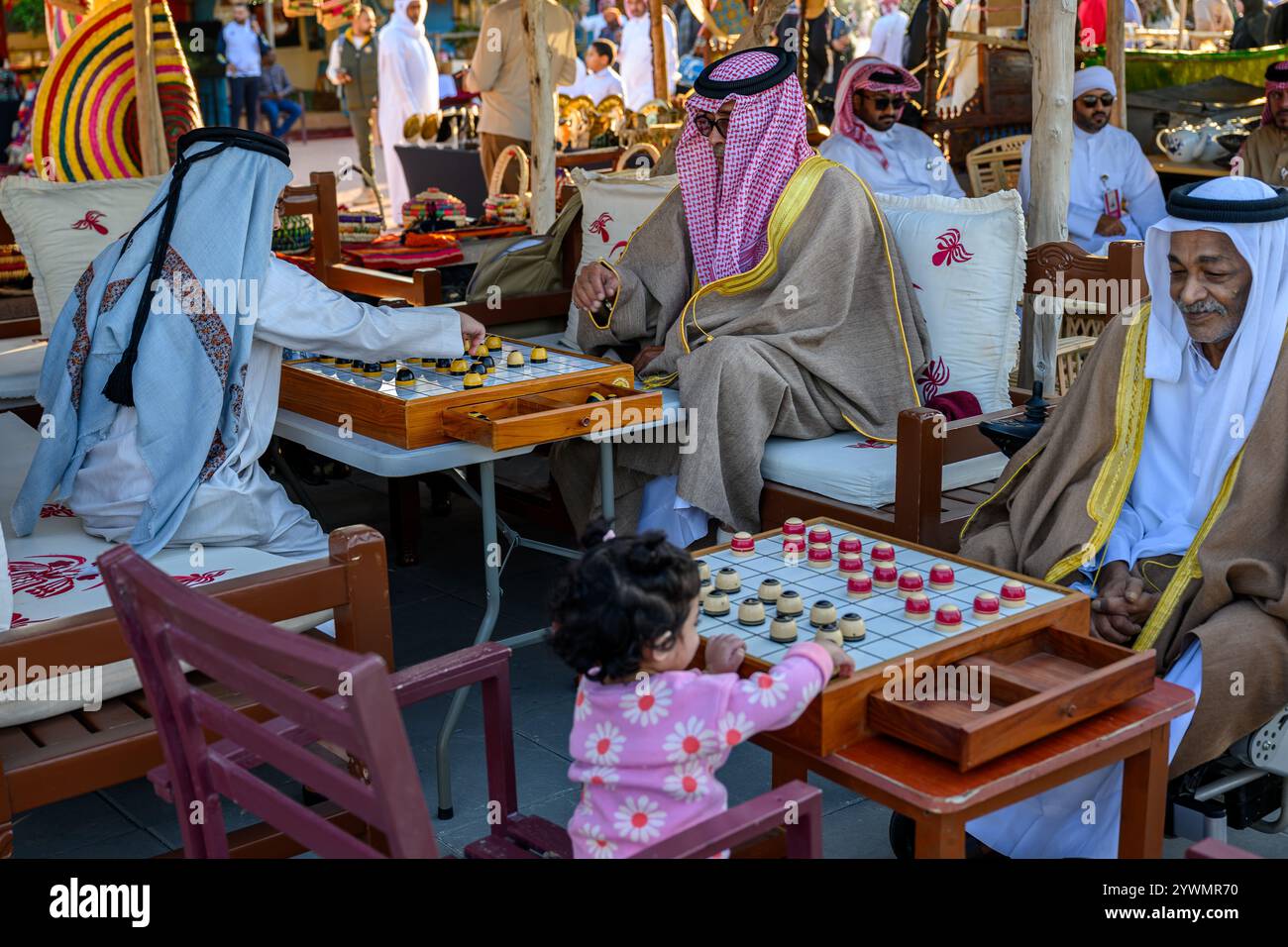 Doha, Qatar, November 29, 2024: Traditional Qatari men playing Dama ...