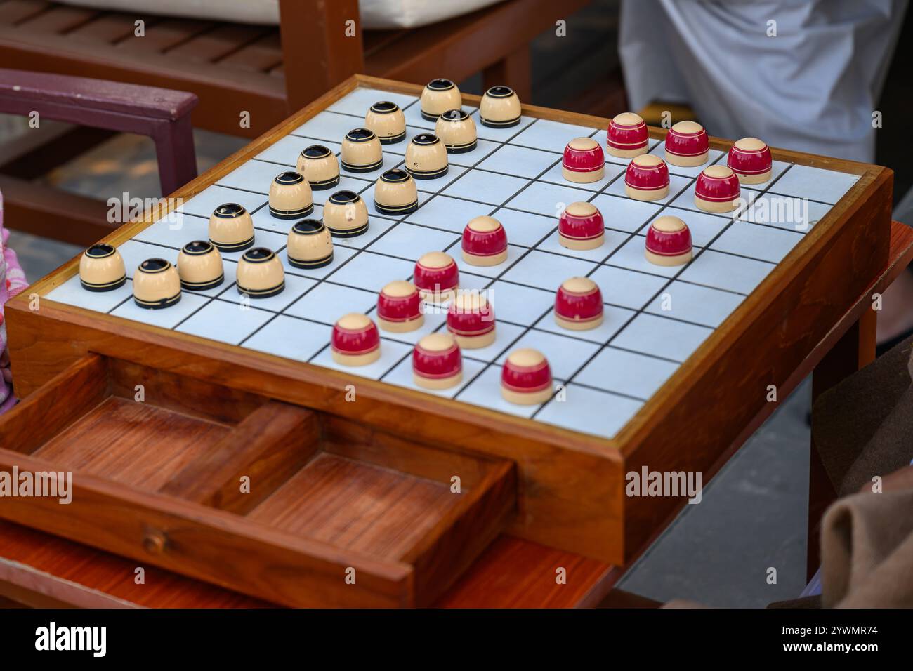 Doha, Qatar, November 29, 2024: Traditional Qatari men playing Dama ...