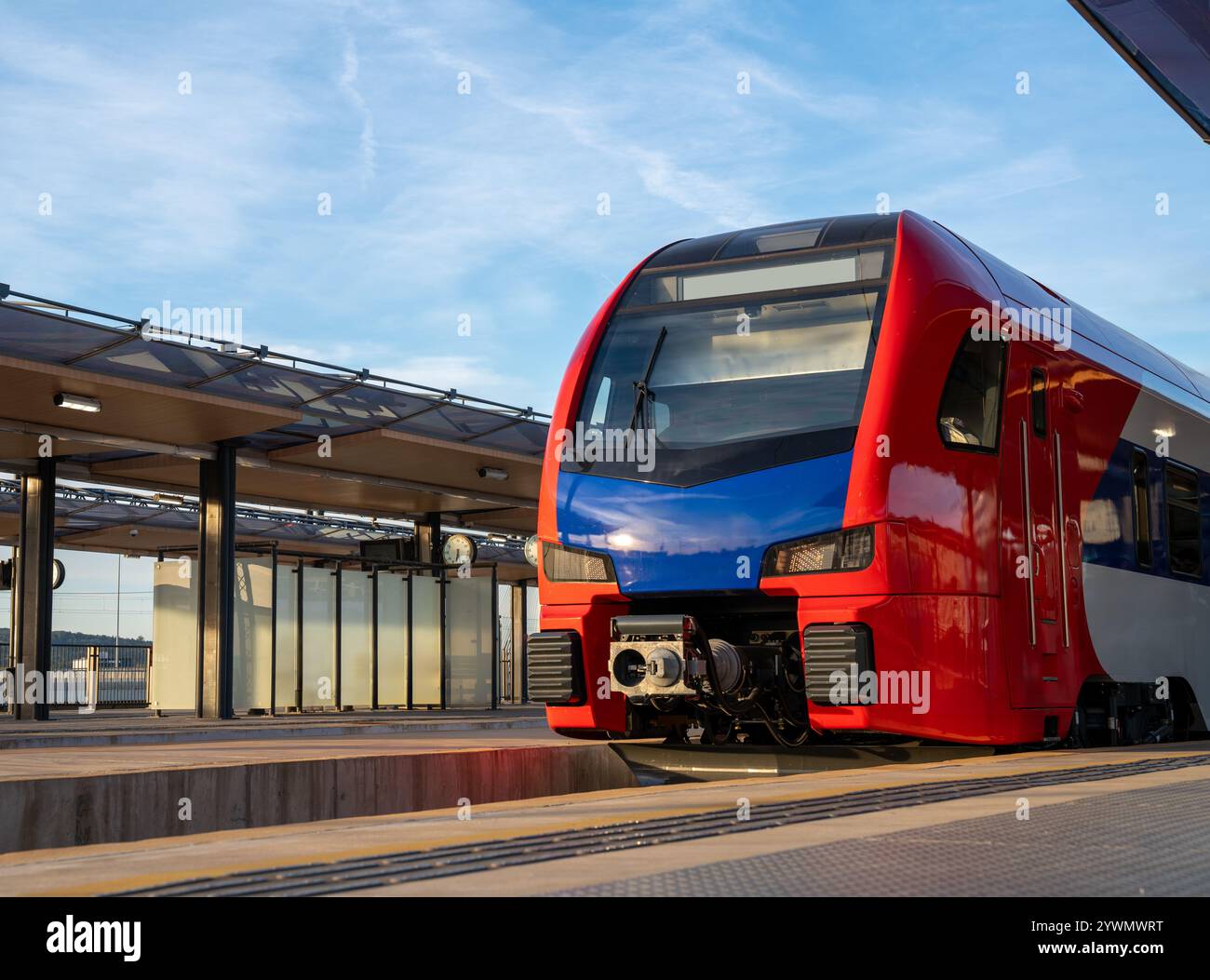 Zero emission train at railroad platform in the station Stock Photo - Alamy