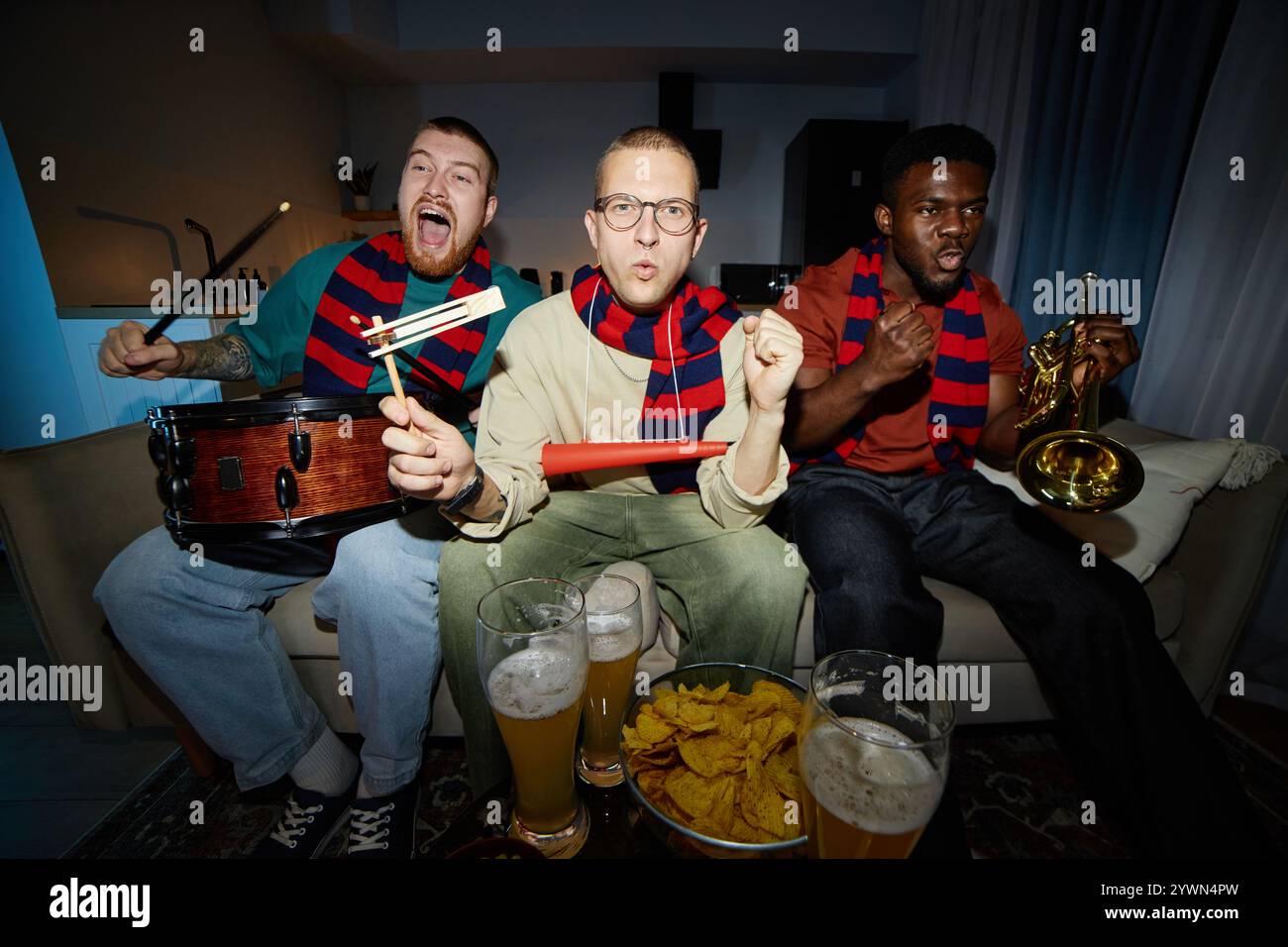 Fisheye front view of excited sports fans cheering and screaming ...