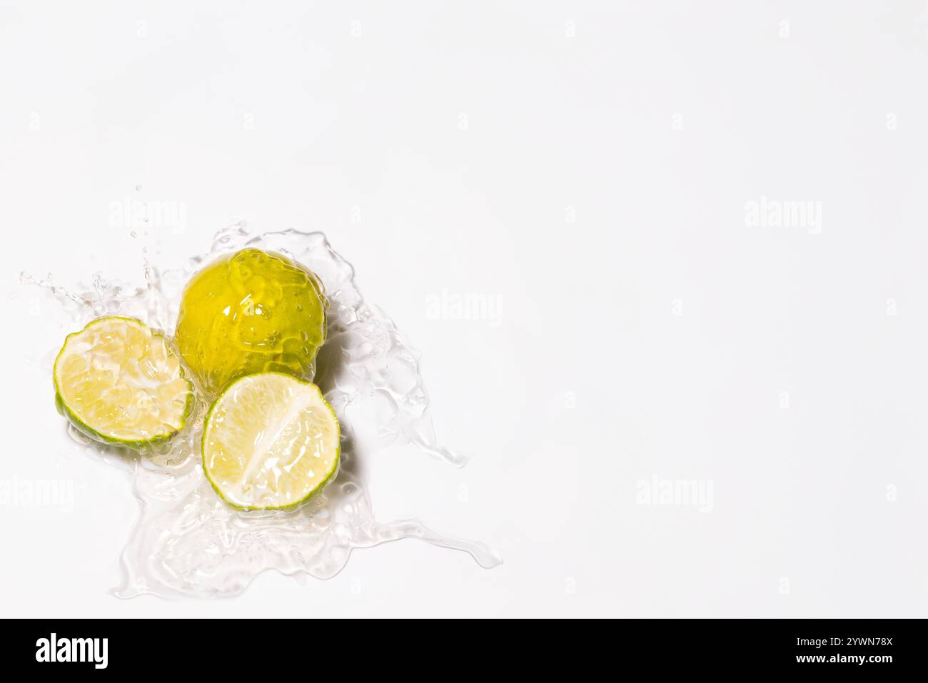 Refreshing Fresh Citrus Limes Juicy with Splashing Water in a Bright ...