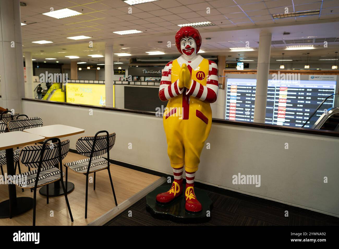 CHIANG MAI, THAILAND - OCTOBER 26, 2023: life-size Ronald McDonald statue greeting customers ...