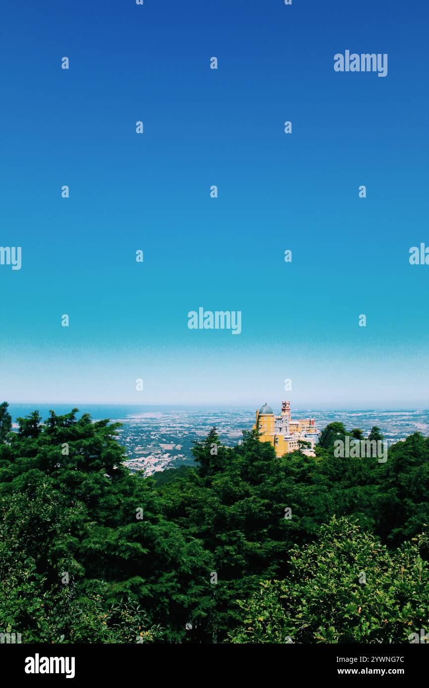 Distant view of Palacio da Pena, Sintra, Portugal. Clear blue sky and ...