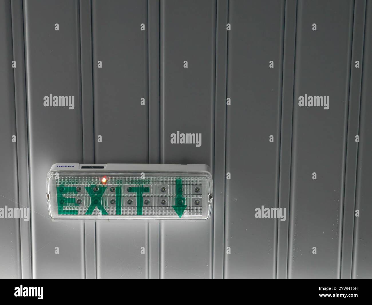 Illuminated Exit Sign: A Path to Escape Stock Photo - Alamy