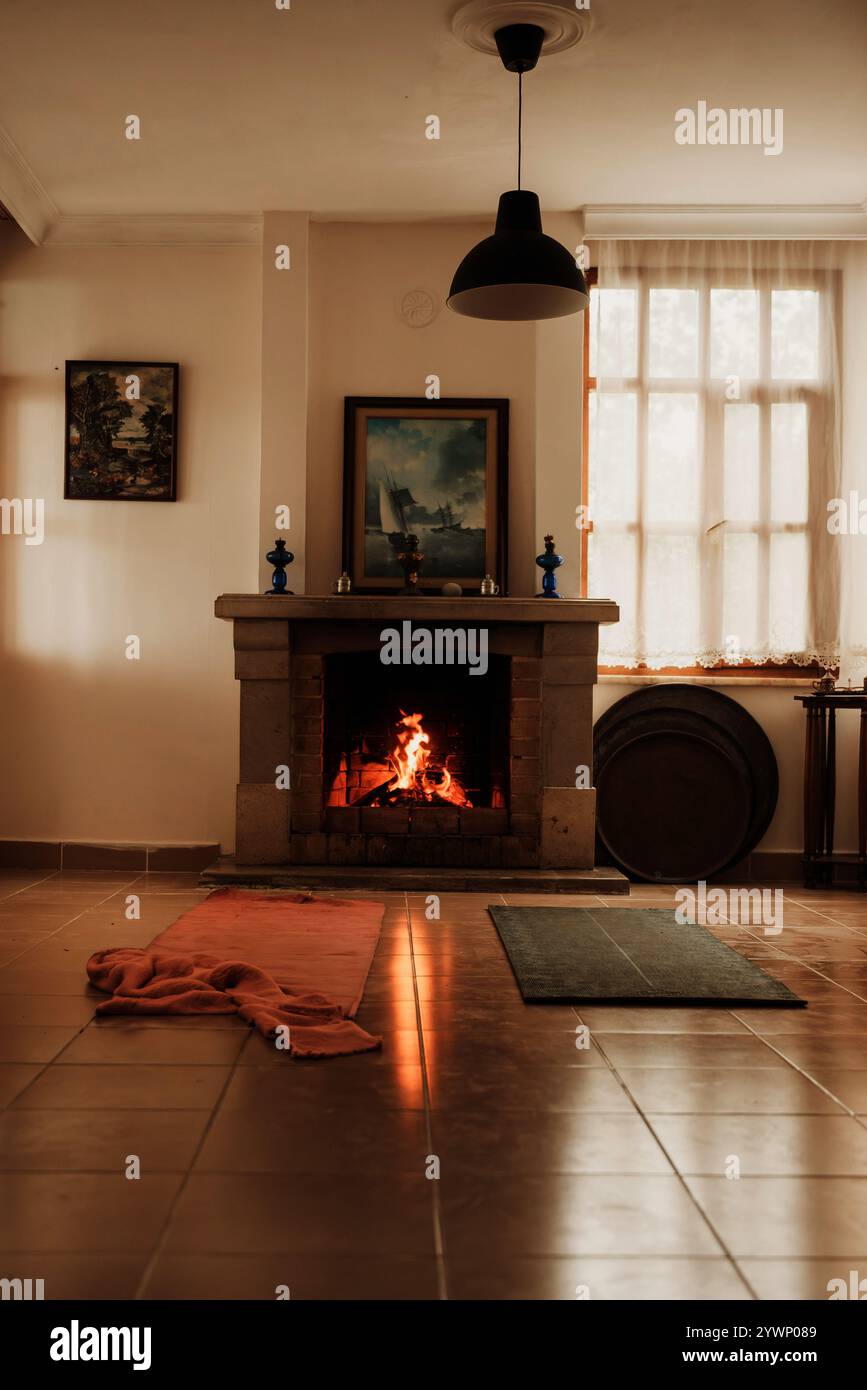 indoor yoga by a fire Stock Photo - Alamy