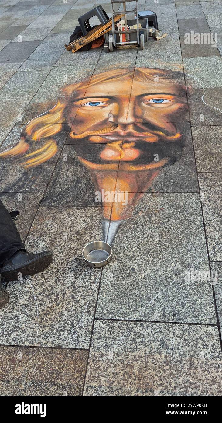 presents graffiti made on the surface of the sidewalk. Art object ...