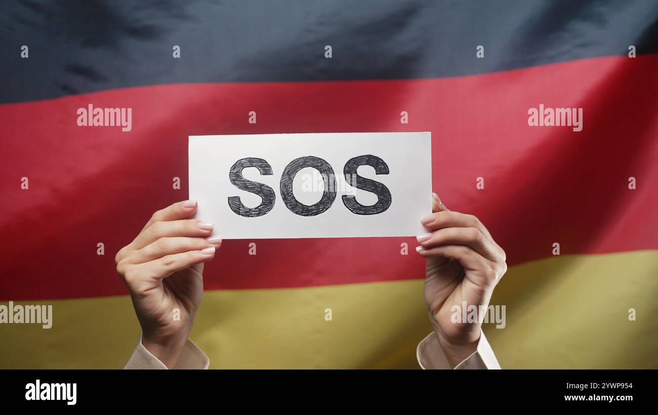 Female Hands With Sos, Alarm, Emergency Card On German National Flag ...
