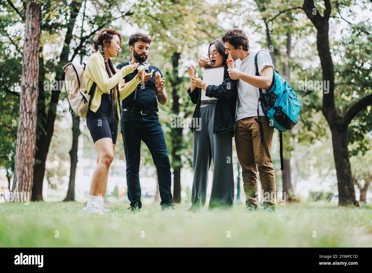 Students and professor enjoying ice cream break after classes outdoors ...