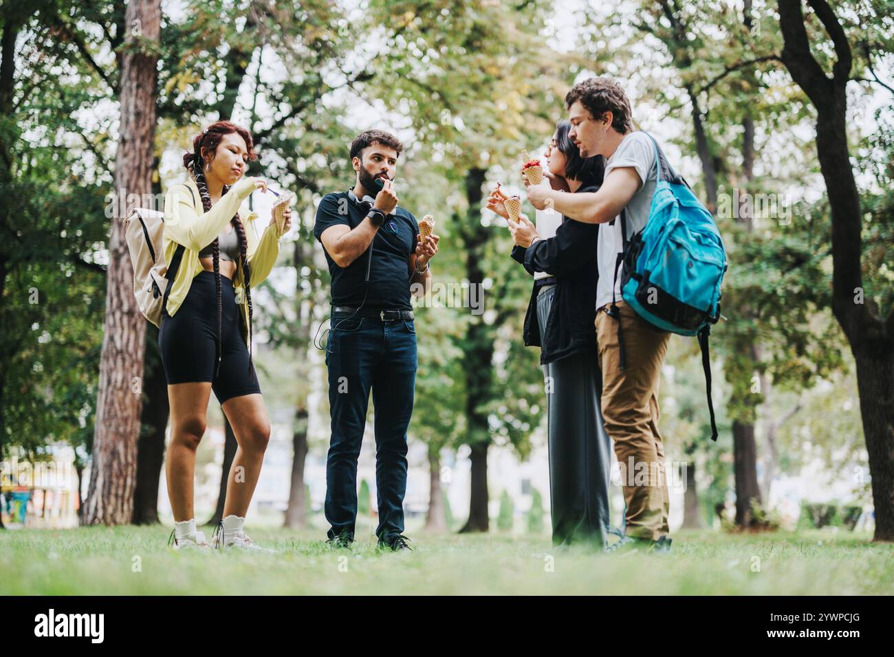 Students and professor enjoying ice cream break in a park setting Stock ...