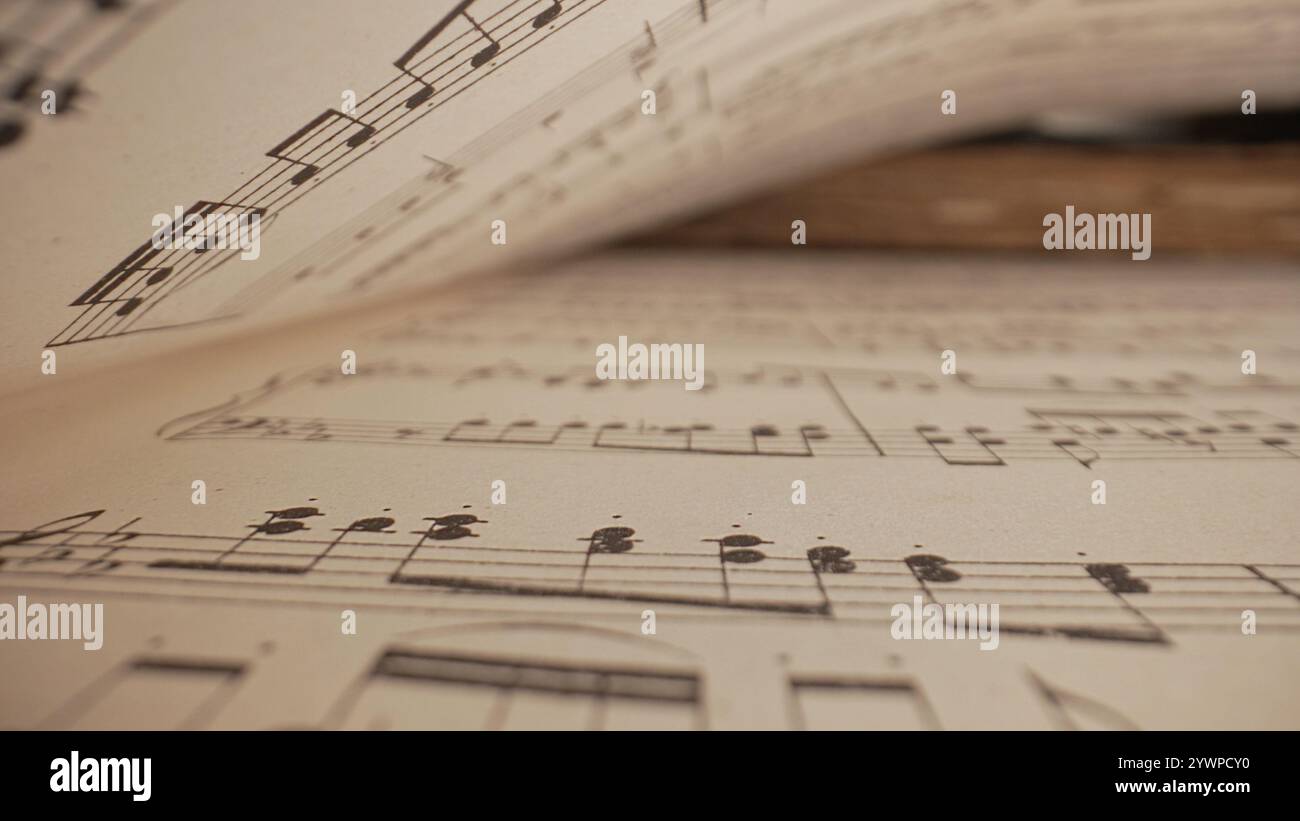 Macro background of saved medieval book with ancient musical notes ...