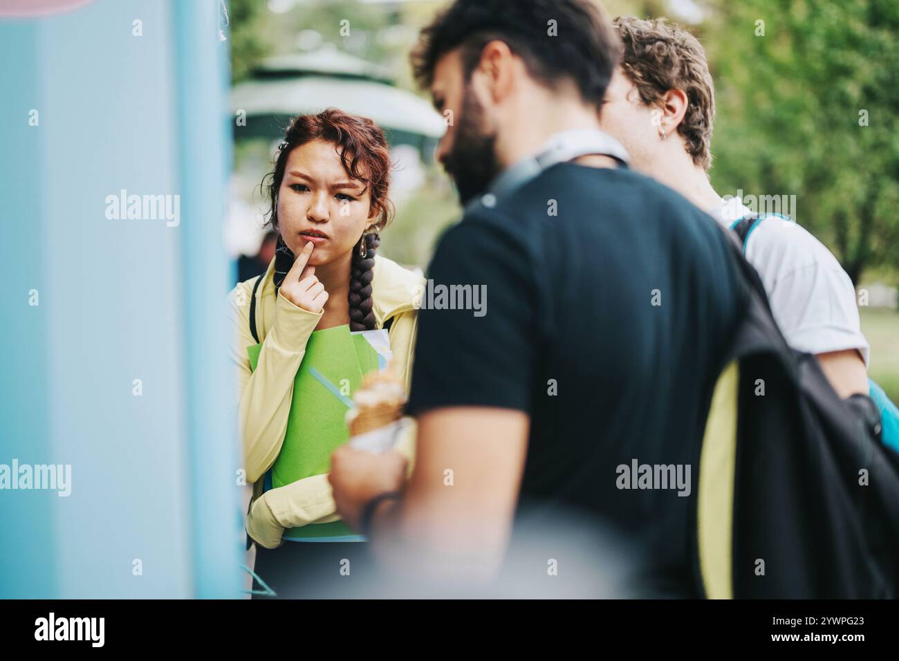 Multicultural students enjoying a park break between class sessions ...