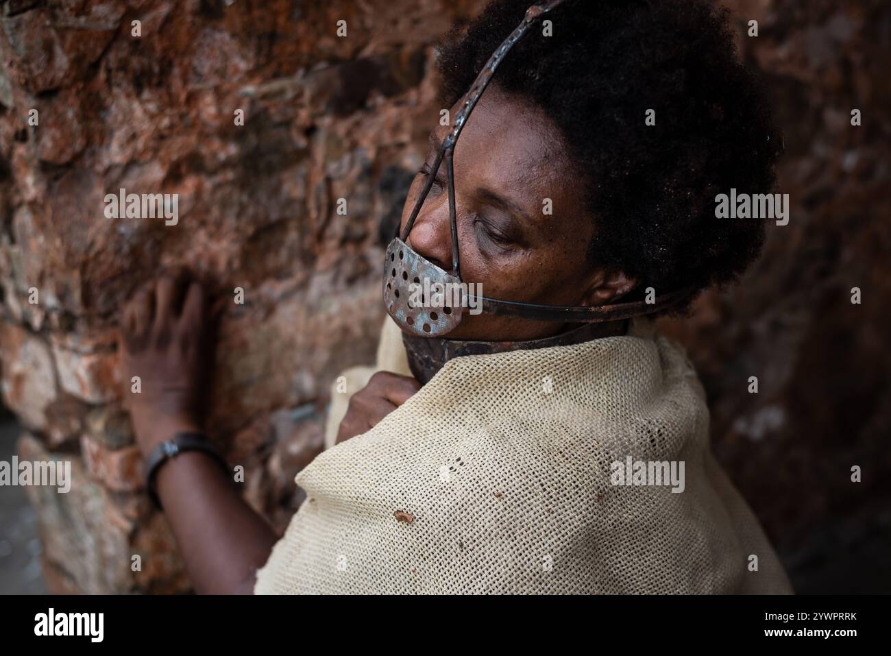 Black woman chained and with an iron mask on her mouth, representing ...