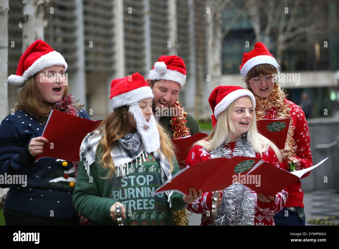 London, England, UK. 11th Dec, 2024. Carol singers in Christmas attire ...