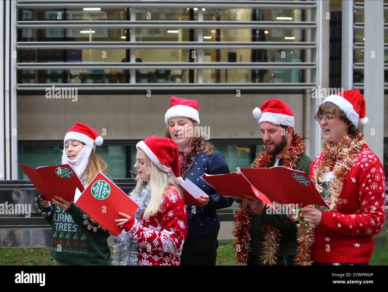 London, England, UK. 11th Dec, 2024. Carol singers in Christmas attire ...