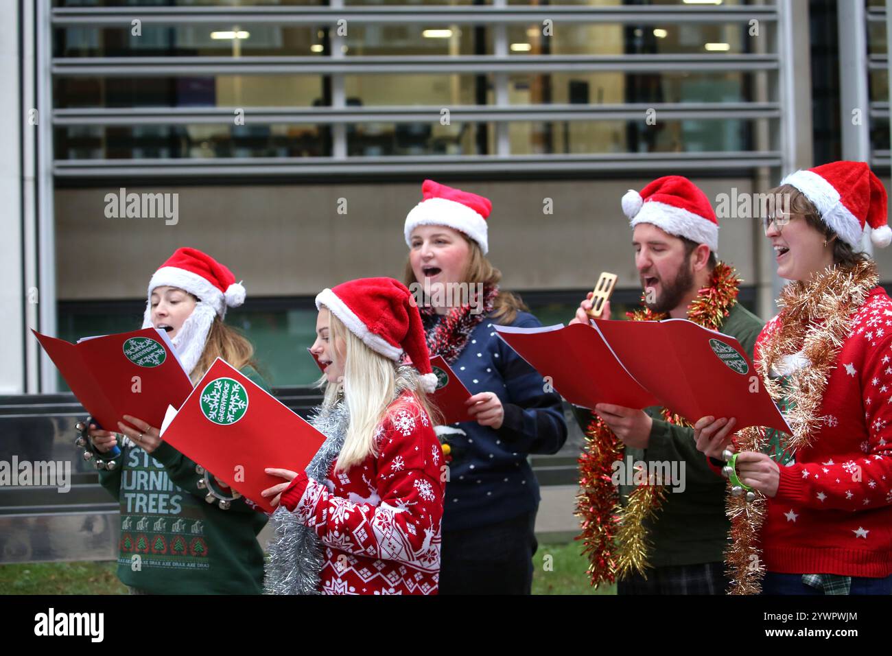 London, England, UK. 11th Dec, 2024. Carol singers in Christmas attire ...