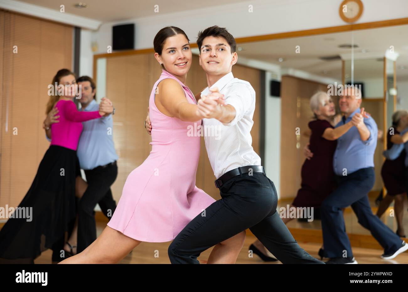 Young couple dancing slow ballroom dance in choreography studio Stock ...