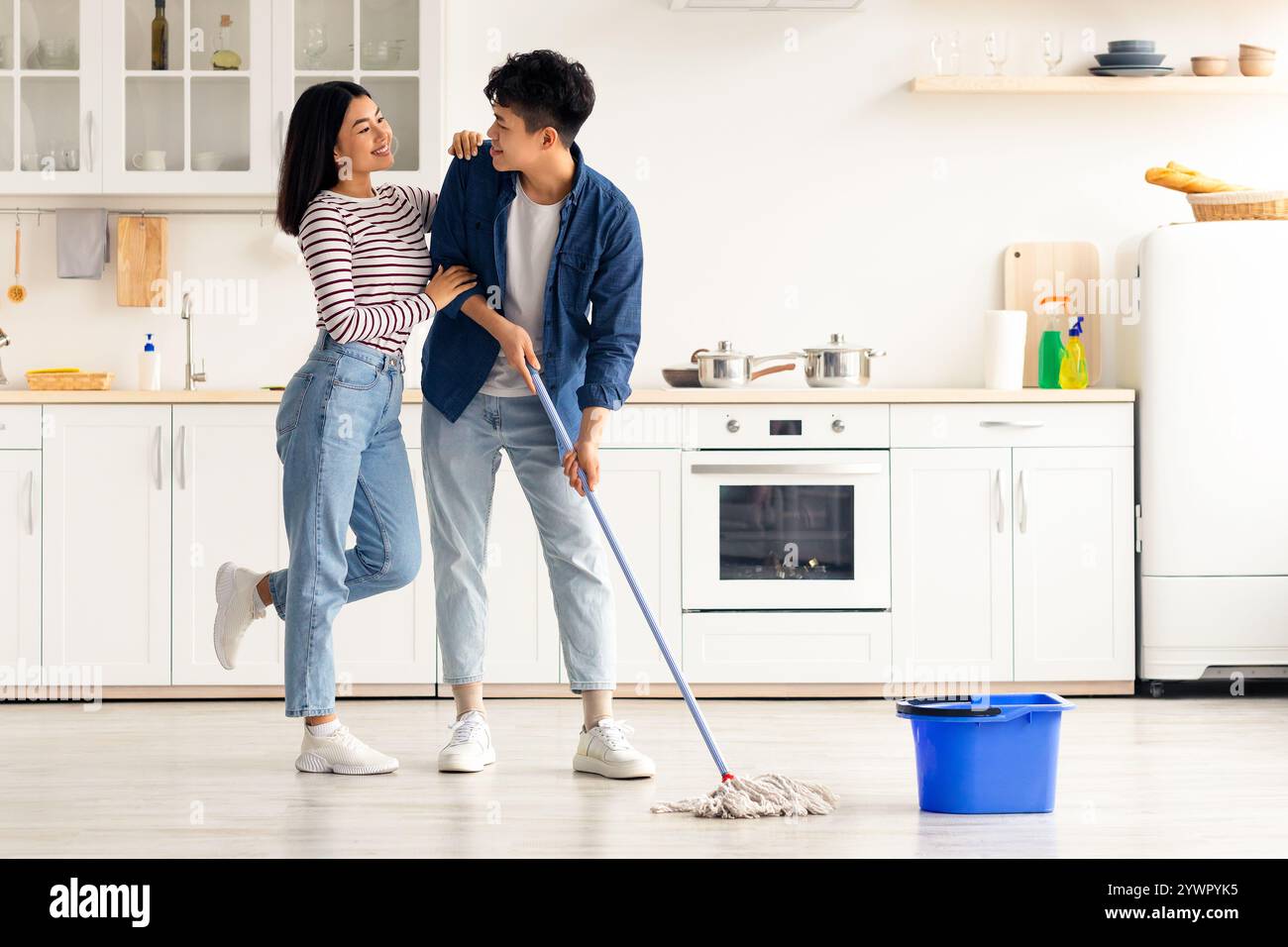 Loving asian couple cleaning hi-res stock photography and images - Alamy