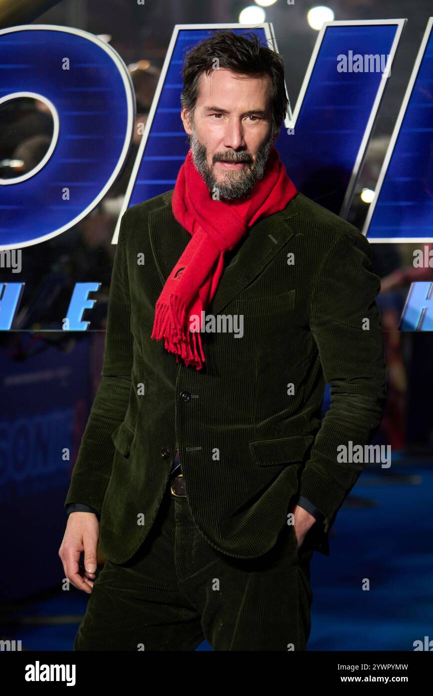 Keanu Reeves poses for photographers upon arrival at the premiere of ...
