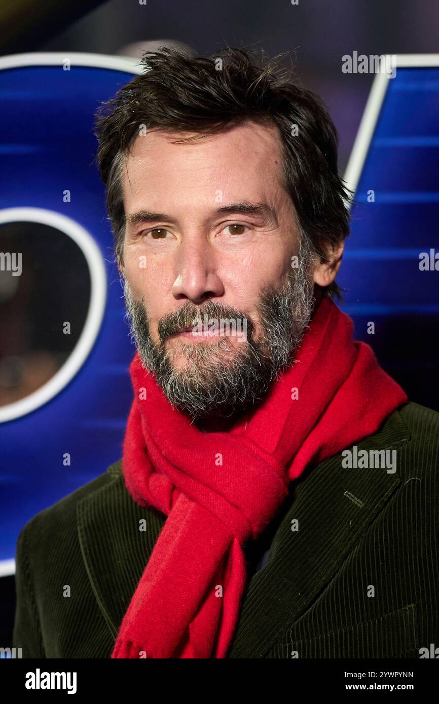 Keanu Reeves poses for photographers upon arrival at the premiere of ...