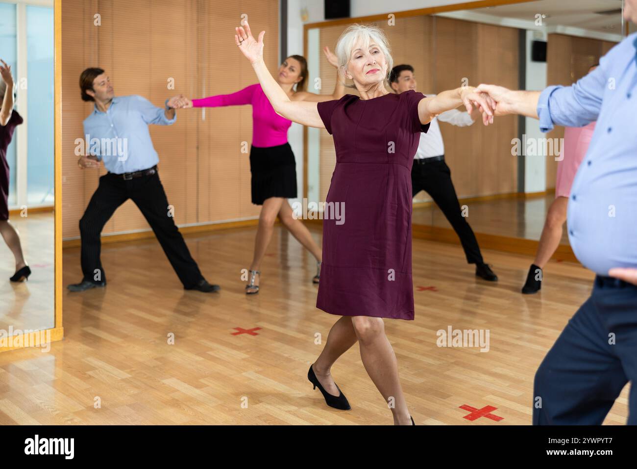 Elderly pair practicing ballroom dance in dance studio Stock Photo - Alamy