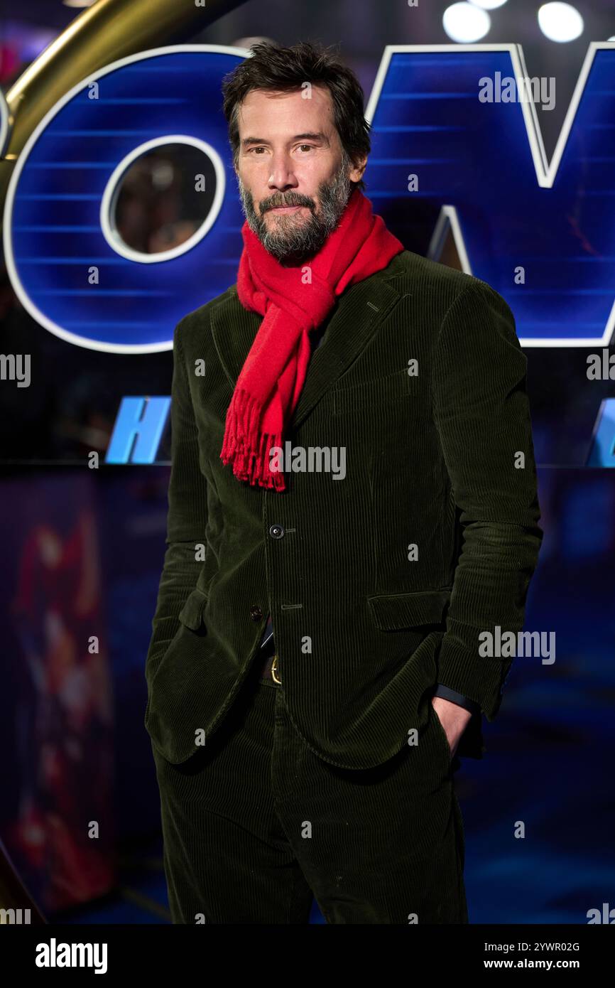 Keanu Reeves poses for photographers upon arrival at the premiere of ...