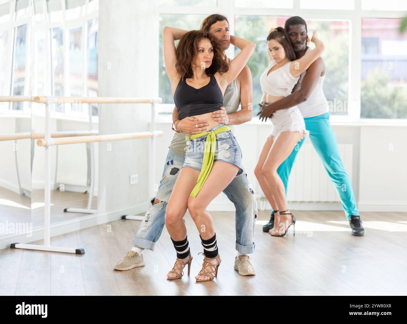 Man and woman in heels dancing latin dances Stock Photo - Alamy