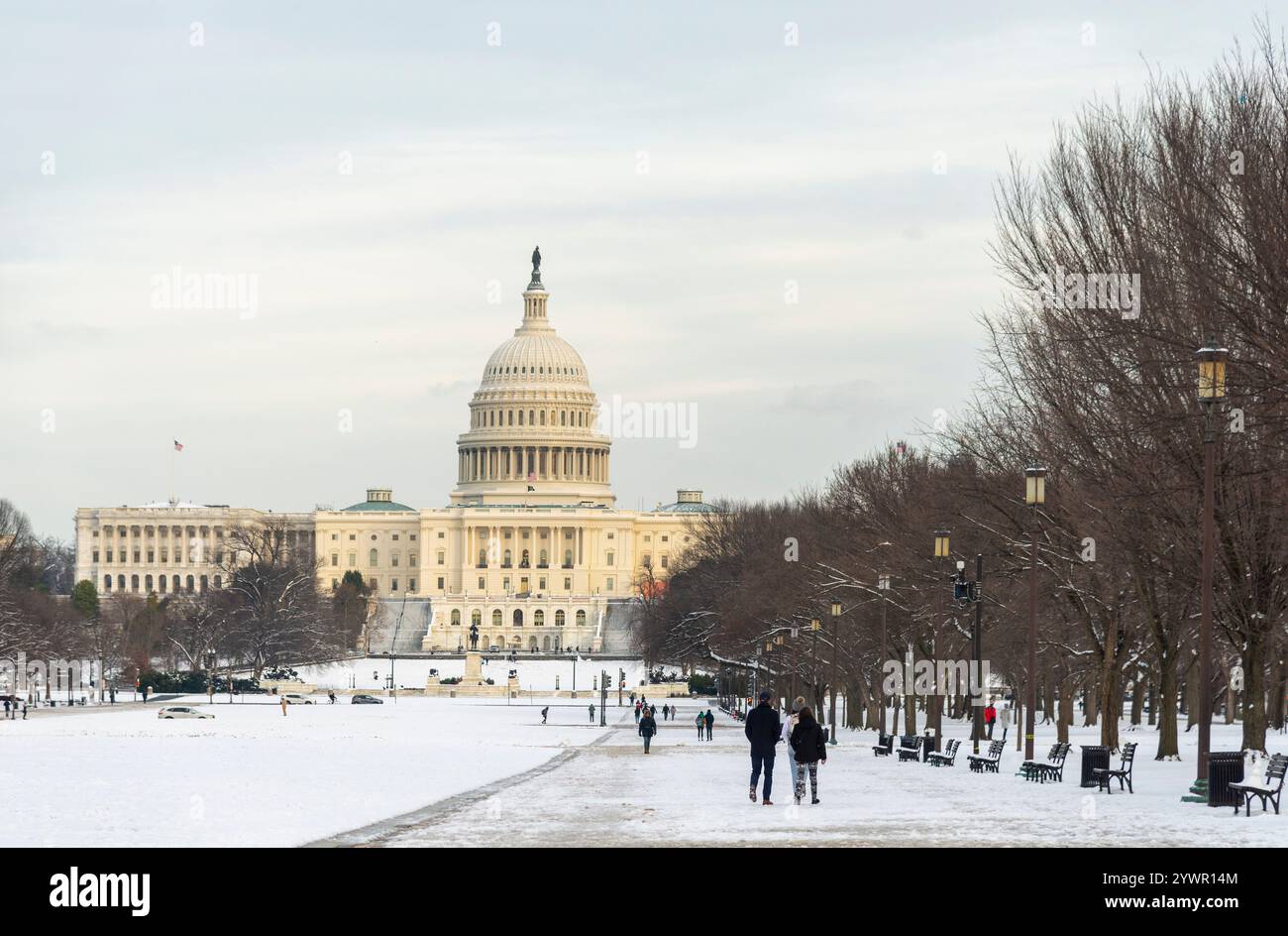 A snow-covered National Mall surrounds the U.S. Capitol Building on a ...