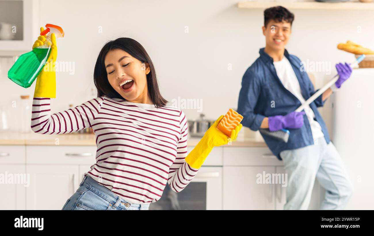 Funny young couple singing dancing hi-res stock photography and images ...