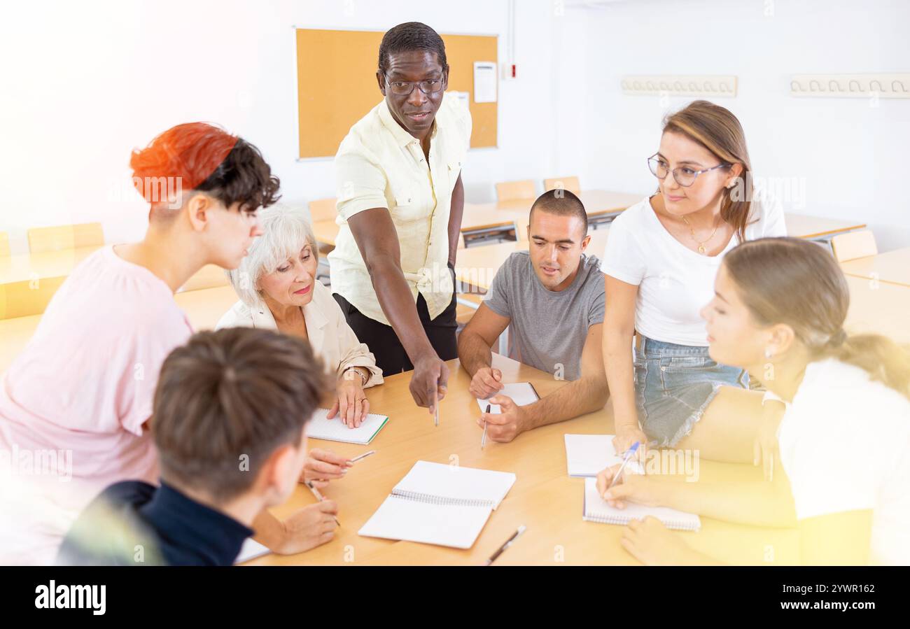 Group people attending language hi-res stock photography and images - Alamy