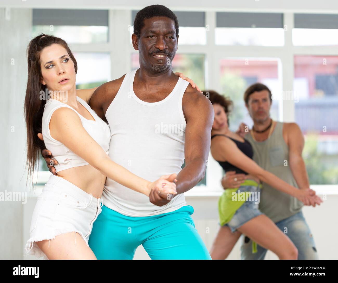 Man and woman dancing couple dance in studio Stock Photo - Alamy