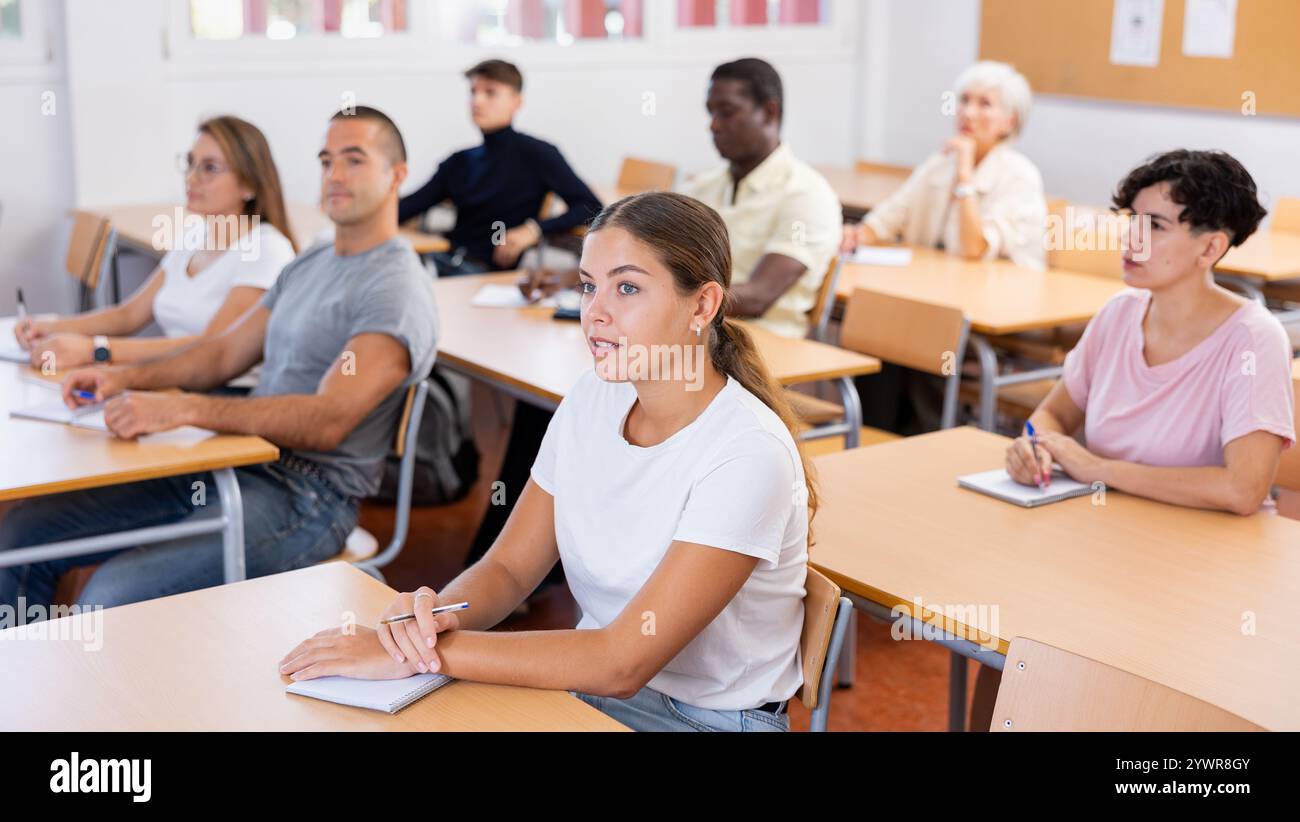 Young woman student attending lecture in classroom Stock Photo - Alamy