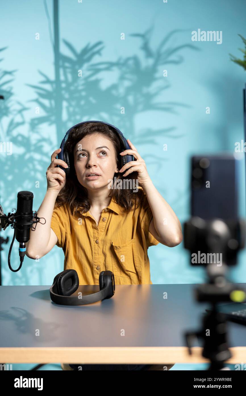 Woman filming herself listening to new album from favorite artist ...
