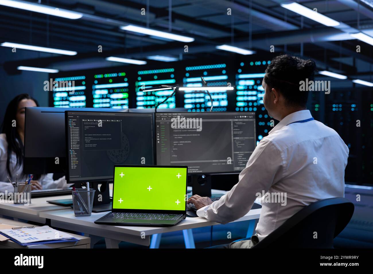 Teamworking Programmers In Data Center Using Isolated Screen Laptop To