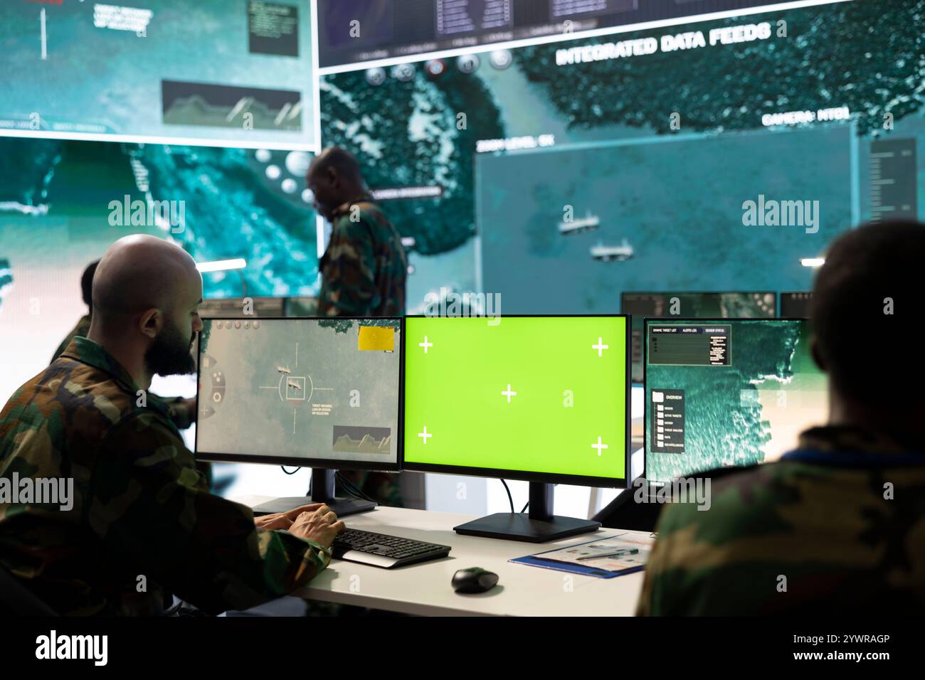 Army soldier working with an isolated pc display next to satellite ...