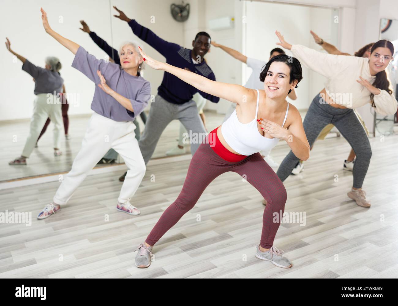 Group of adult people practices dance aerobics Stock Photo - Alamy
