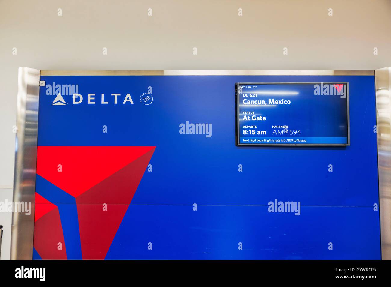 Delta Airlines flight DL 621 to Cancun, Mexico, displayed on boarding gate sign at Newark ...