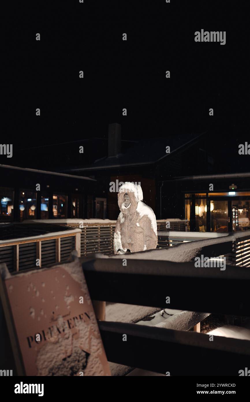 Statue of a man in Longyearbyen, Svalbard shopping centre in the polar ...