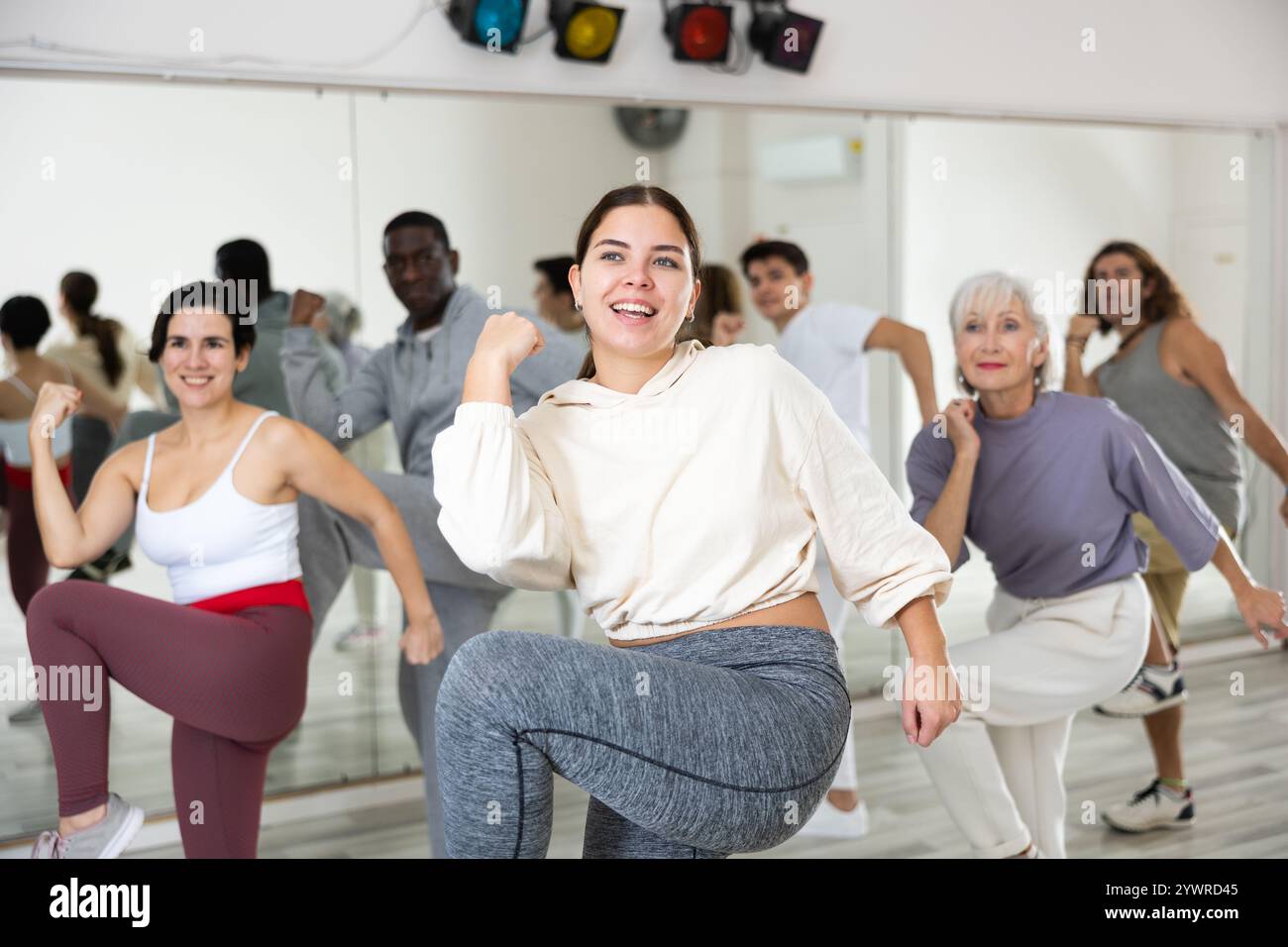 Group of people of different nationalities learn sports dance Stock ...