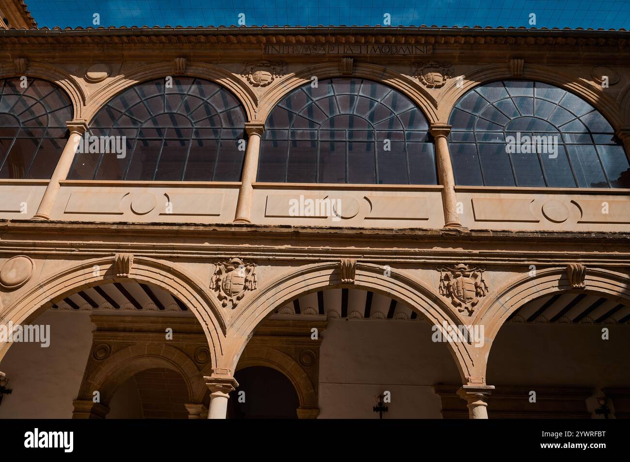 Close-up of a historic building facade featuring elegant arched windows ...
