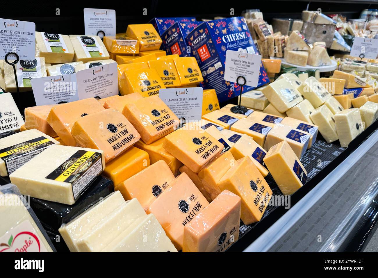 Varieties of cheese bricks on the shelves in a supermarket Stock Photo - Alamy