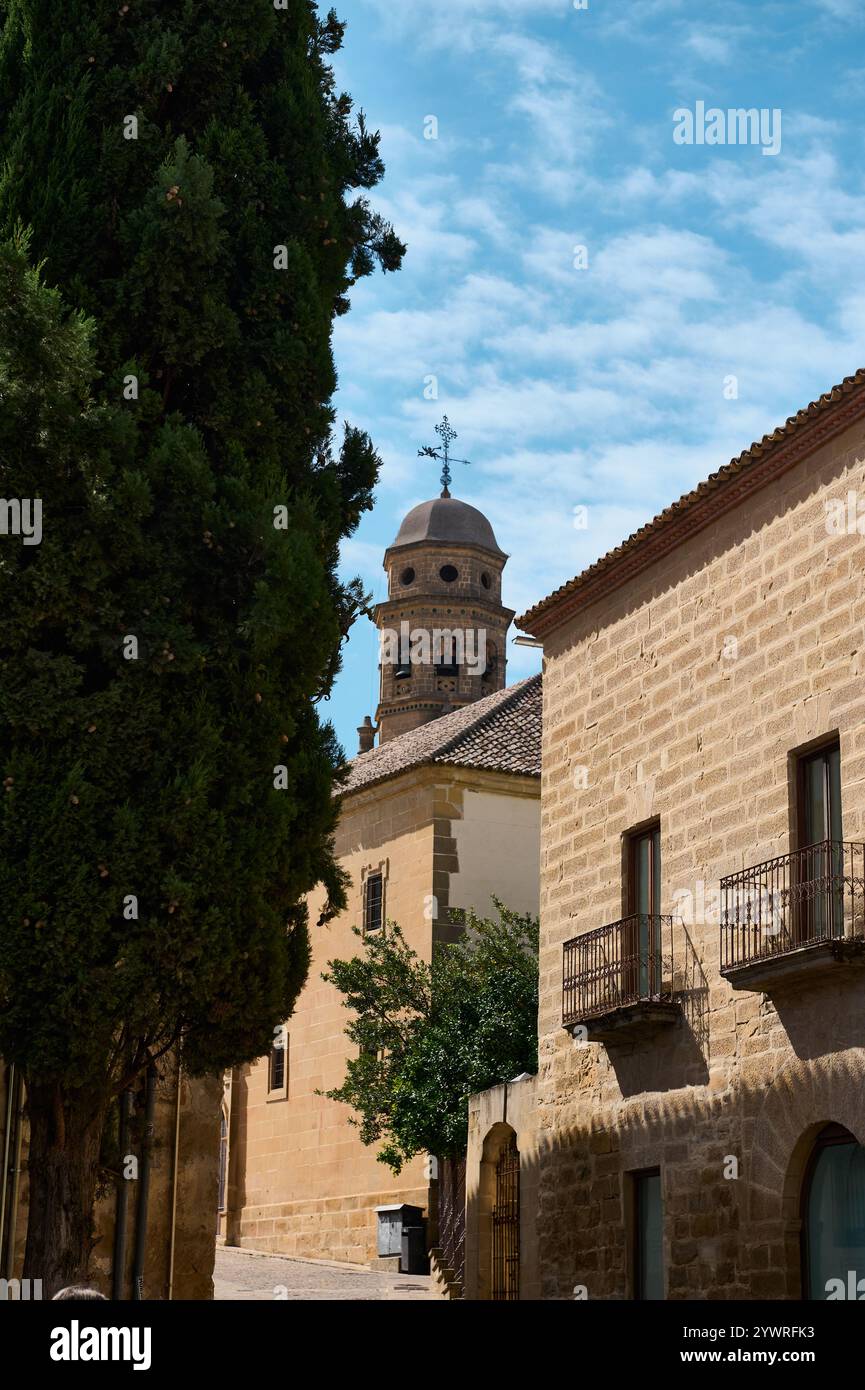 A charming scene featuring an ancient stone structure with a bell tower ...
