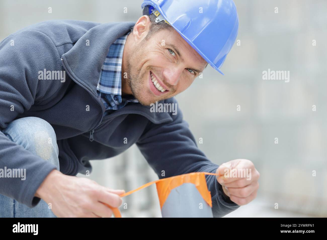 a worker assembly sewerage system Stock Photo - Alamy