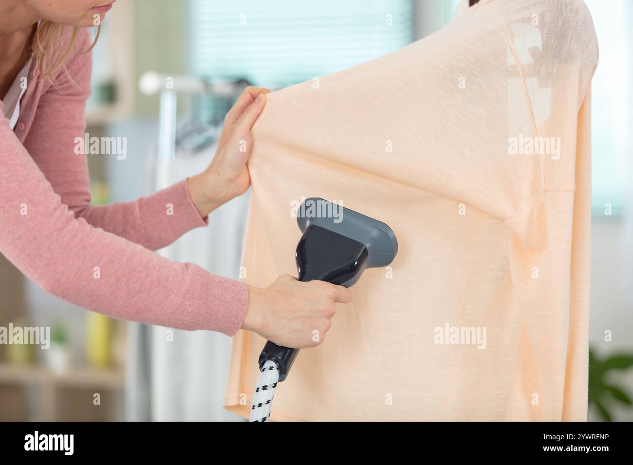 Woman steaming steam cleaner shirt hi-res stock photography and images ...