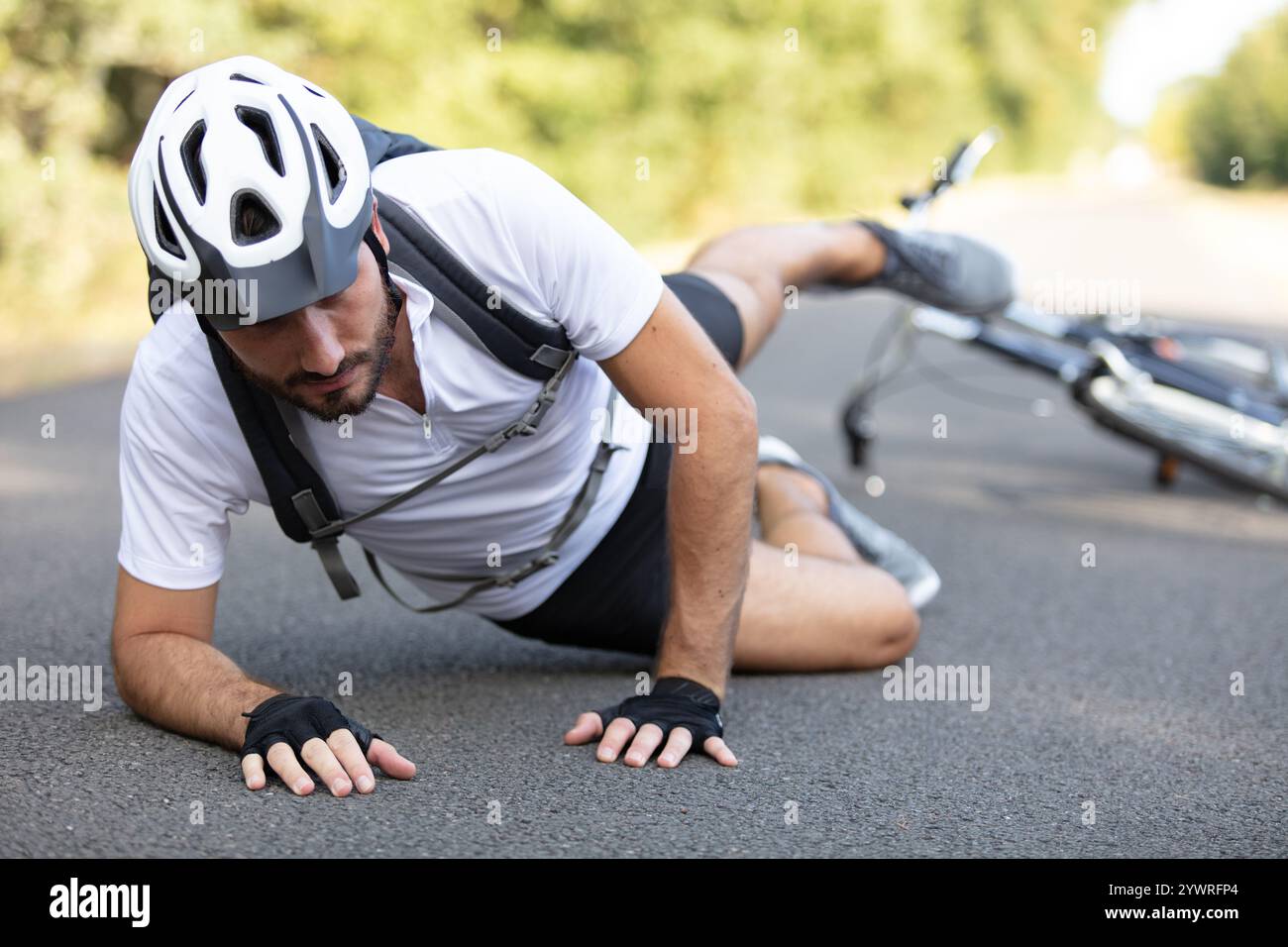 Man lying on ground after accident hi-res stock photography and images ...