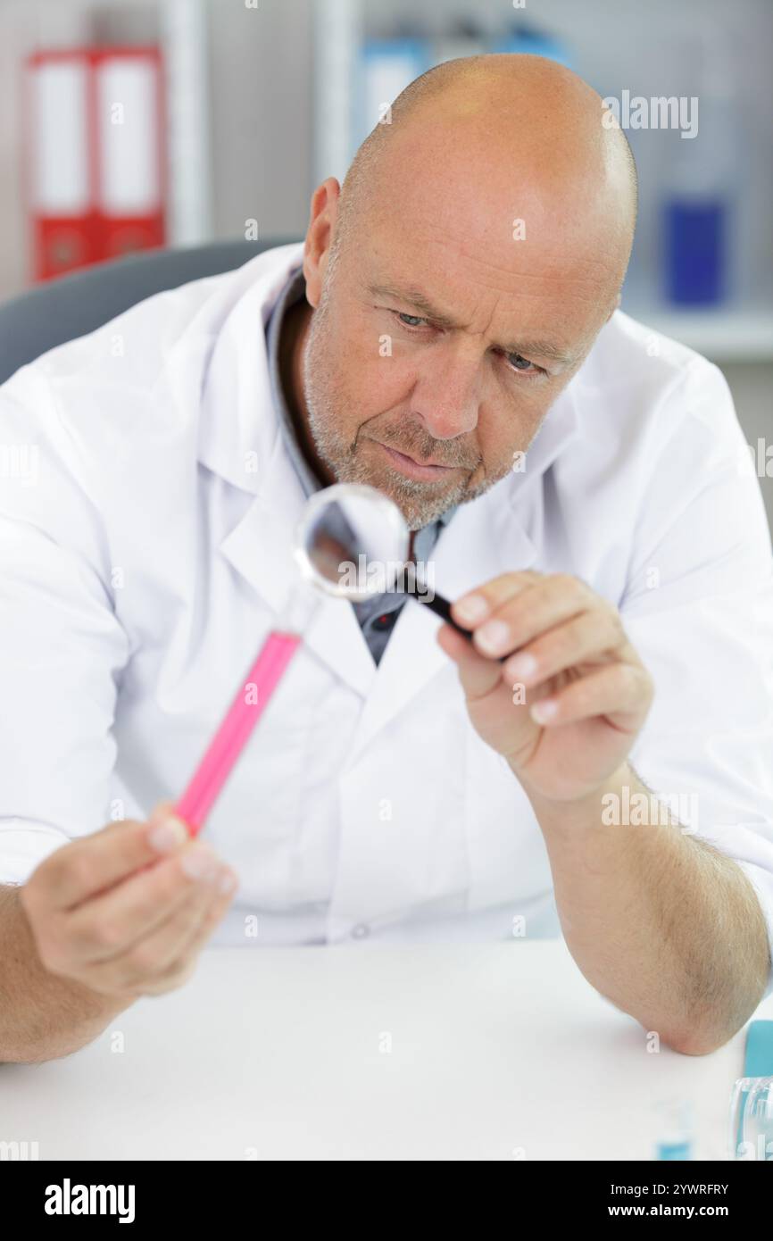 man evaluating molecules in a chemistry lab Stock Photo - Alamy