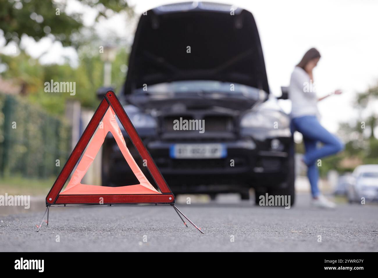 warning triangle on the background of the car Stock Photo - Alamy