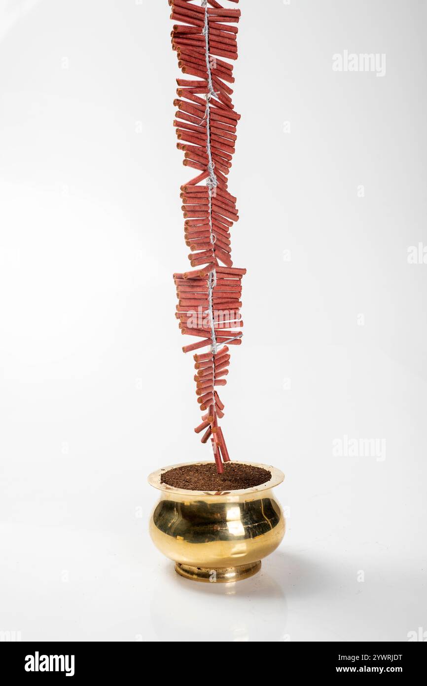 Incense pot with a string of Chinese firecrackers on the rope hanging ...